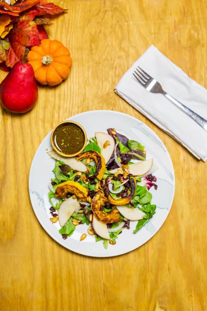 Fall salad with roasted acorn squash, pears, and maple mustard dressing